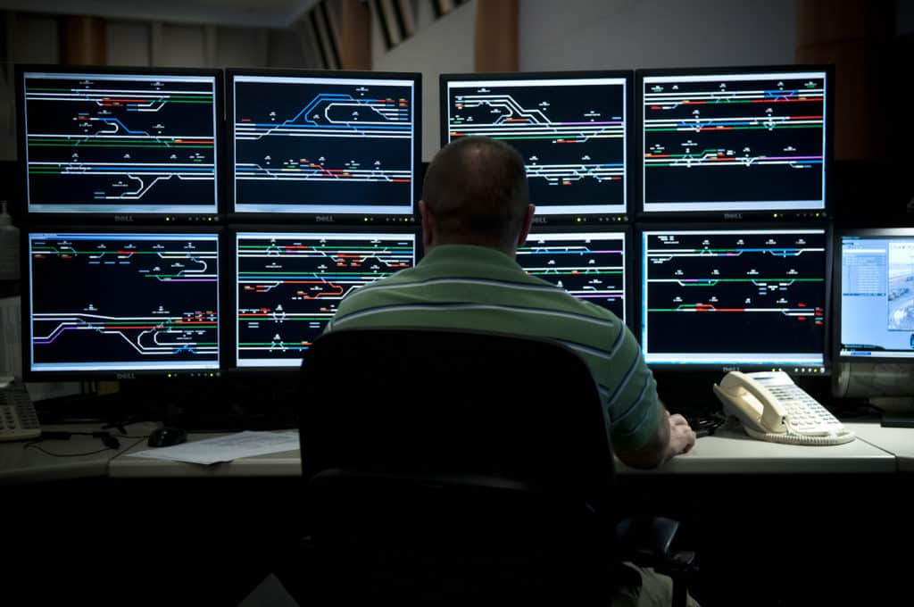 Man Computer Train Routes Tech - Association of American Railroads